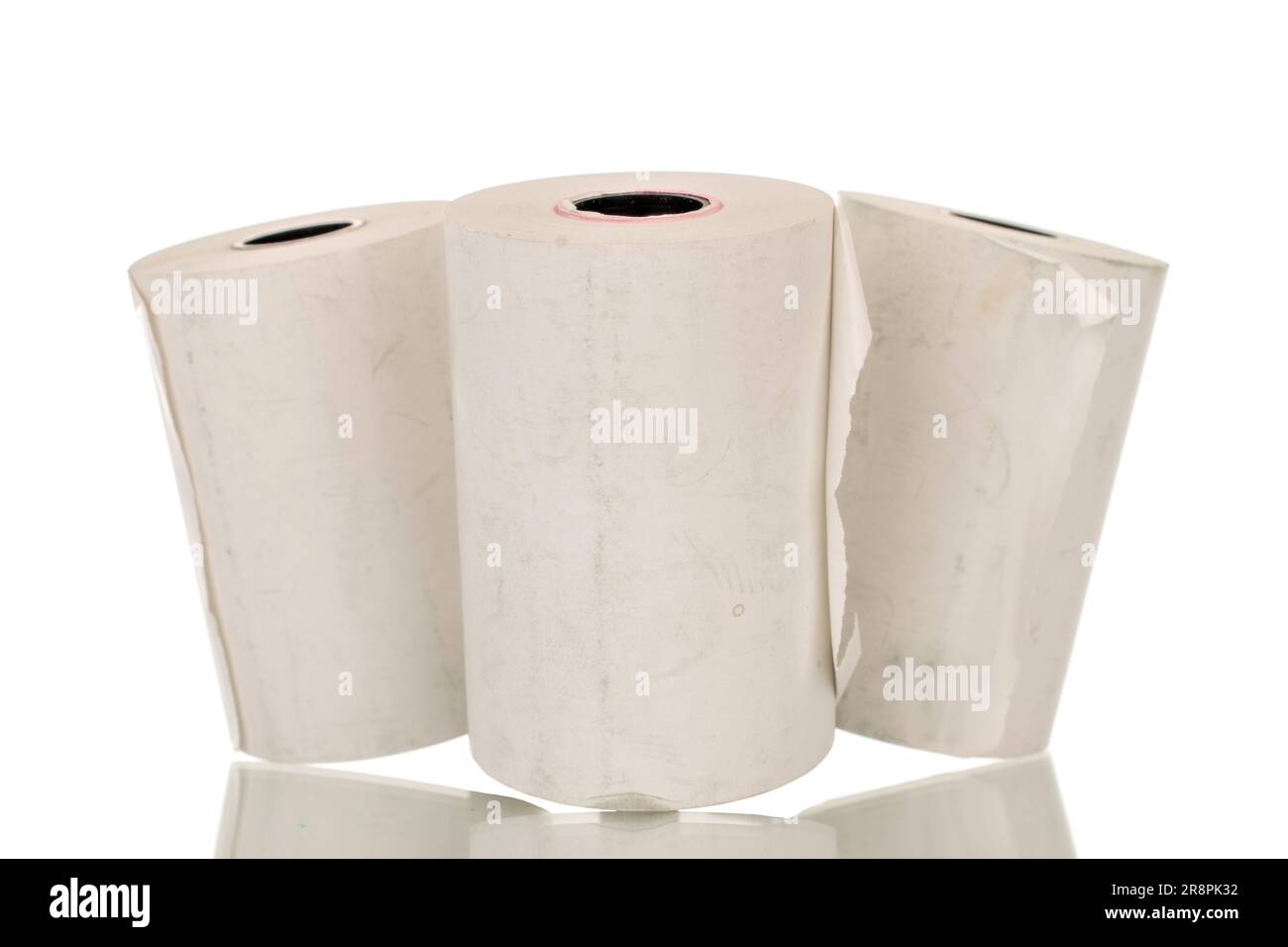 Three rolls of paper cash register tape, close-up isolated on white ...