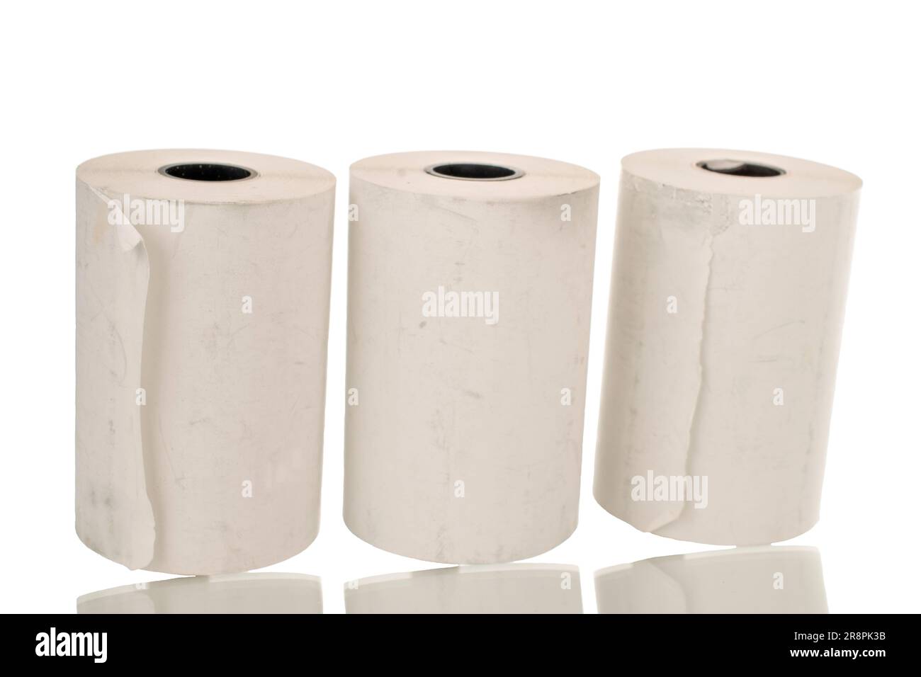 Three rolls of paper cash register tape, close-up isolated on white ...