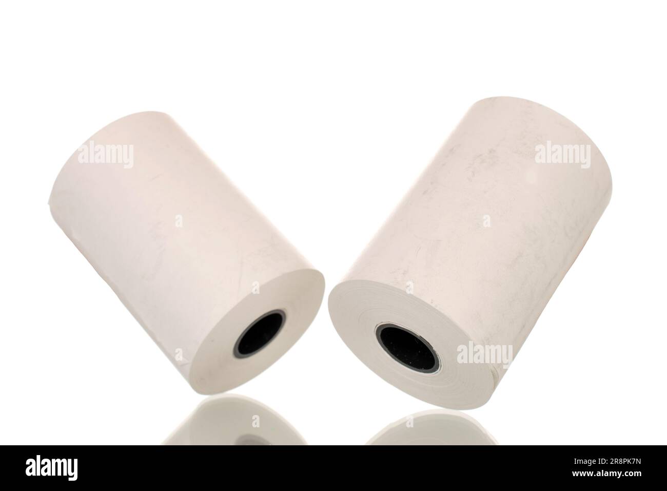 Two rolls of paper cash register tape, close-up isolated on white ...