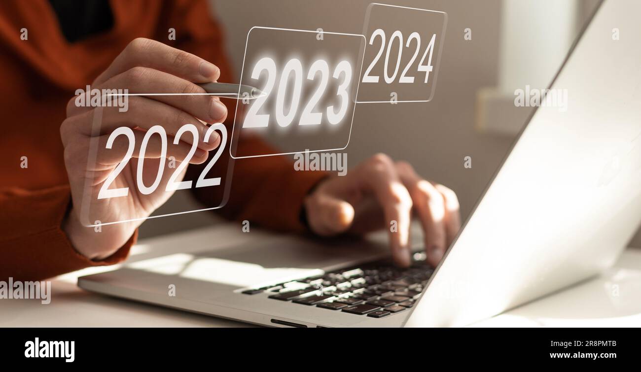 Businessman pointing to digital 2024 on virtual screen. Countdown to ...