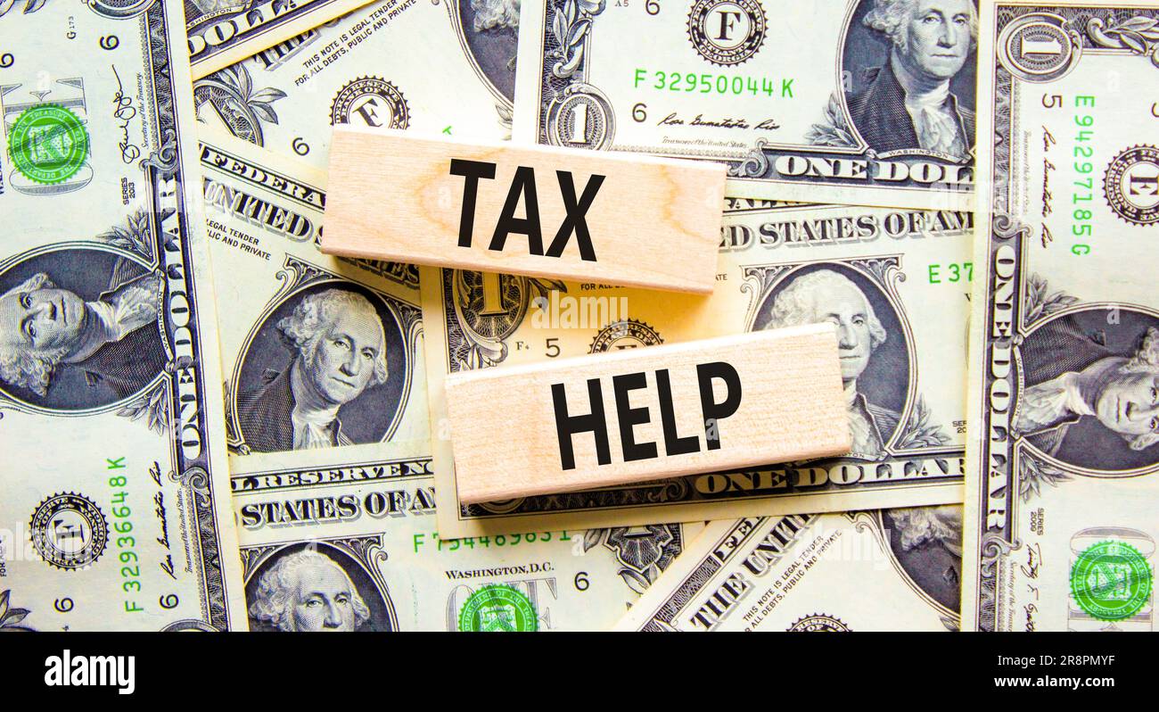 Tax help symbol. Concept words Tax help on wooden blocks on a beautiful ...