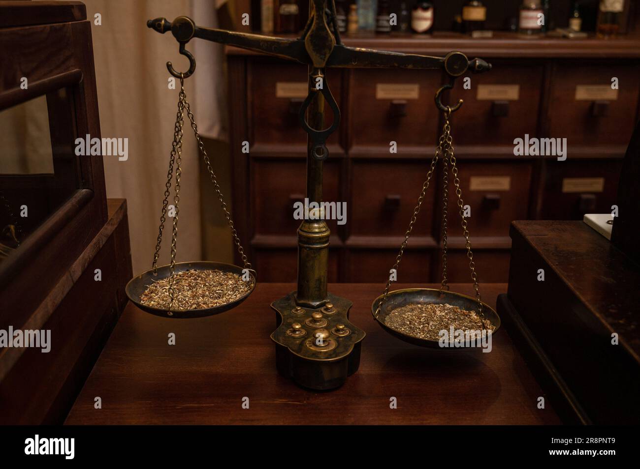 Old classic weight scale on the table of retro pharmacy from the 19th ...