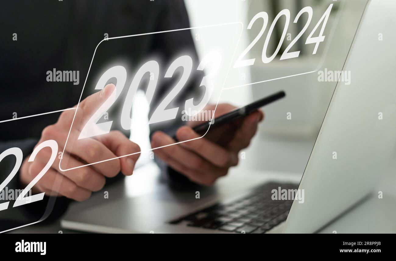 Businessman pointing to digital 2024 on virtual screen. Countdown to ...