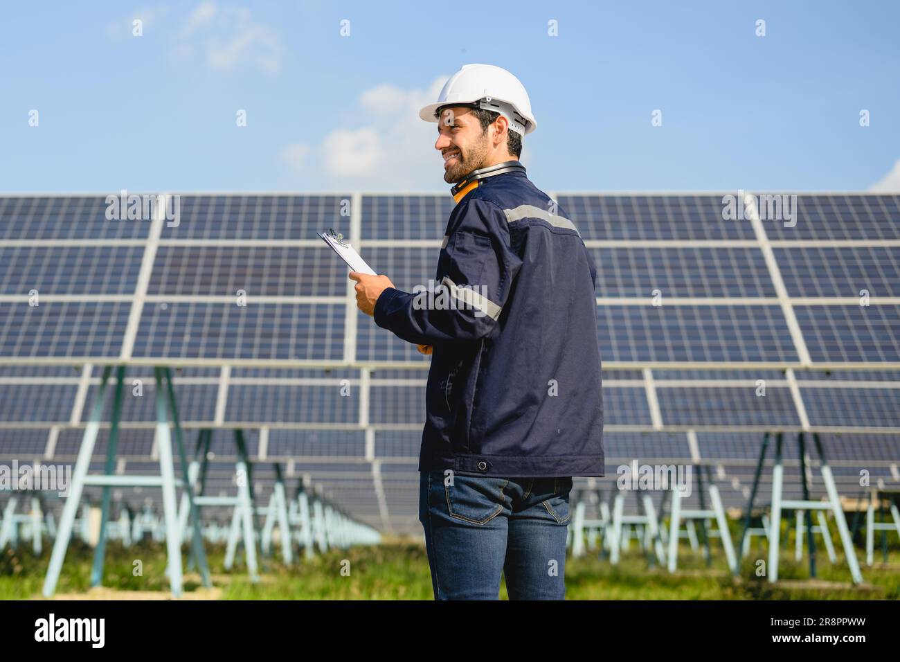 Technician worker installing solar panels at solar cell farm Stock ...