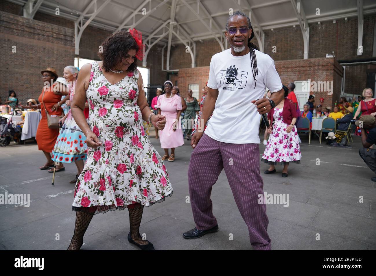 Guests dance at a reception following the arrival of a Thames Clipper ...
