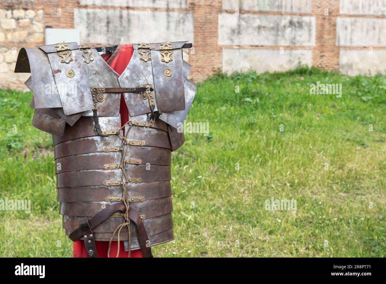 outdoor scene in vertical view of armor, tunic and belt of soldier from ...