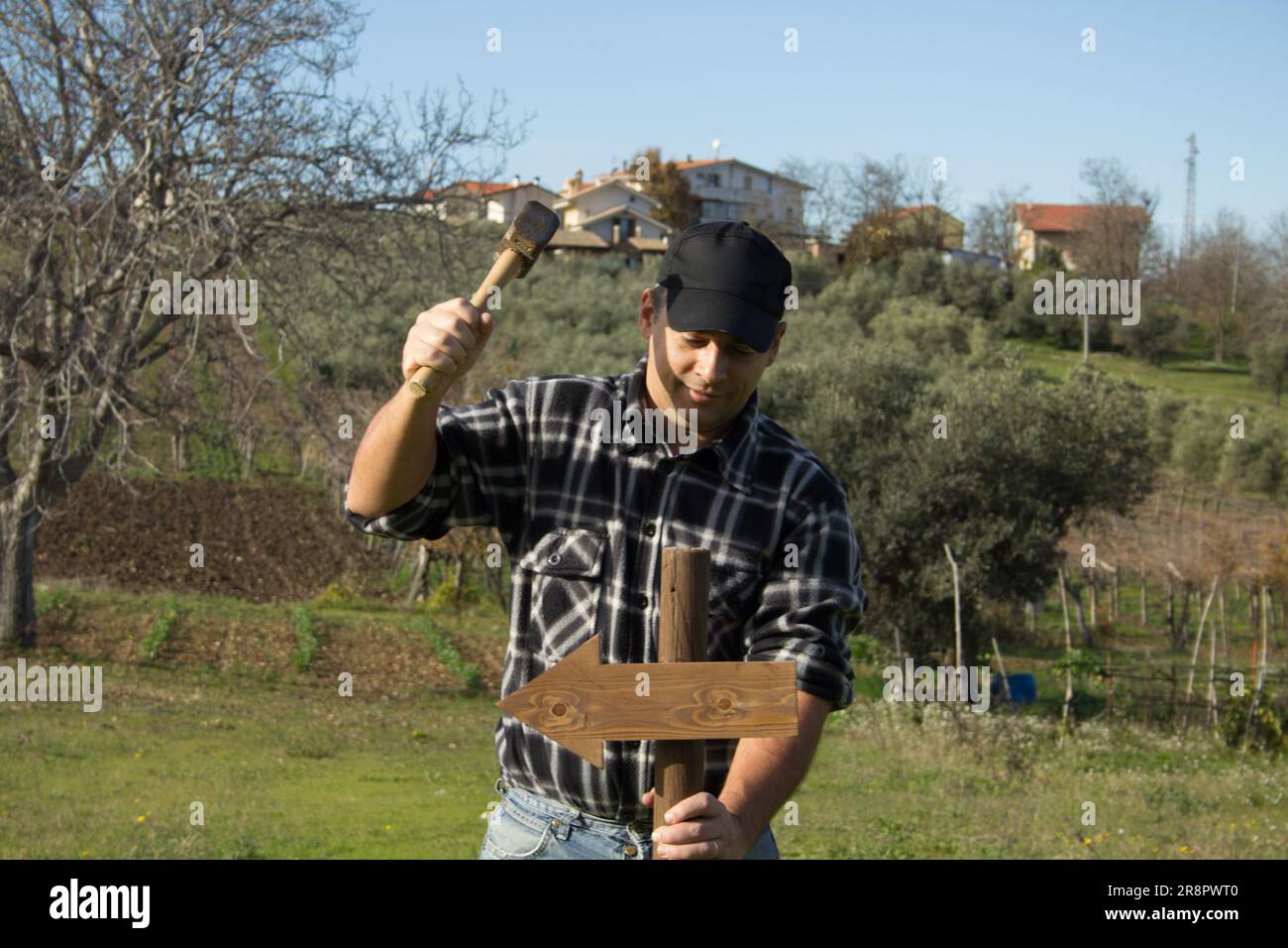 Man driving stake into ground hi-res stock photography and images - Alamy