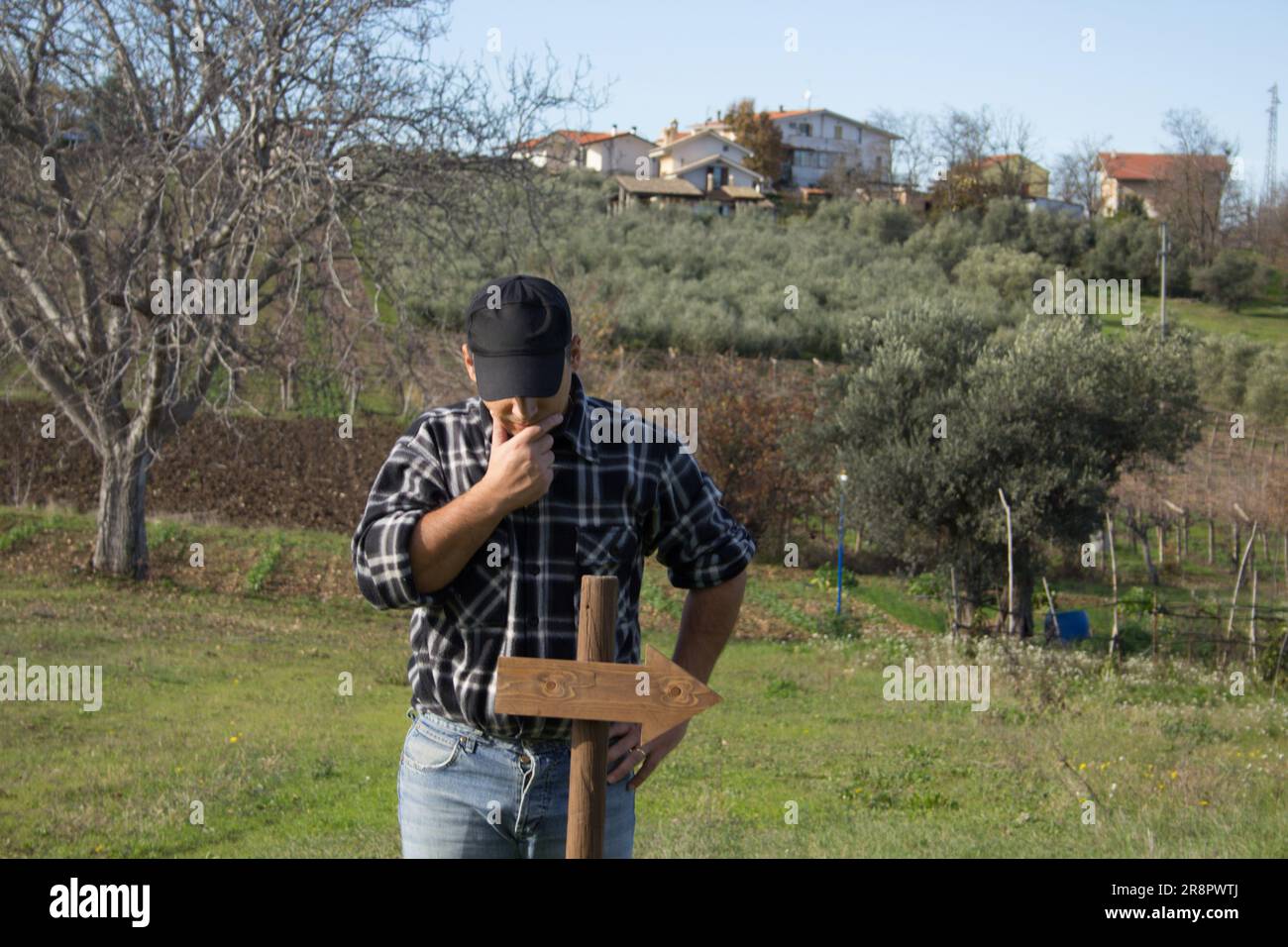Image of a perplexed man looking at a post with an arrow indicating the ...