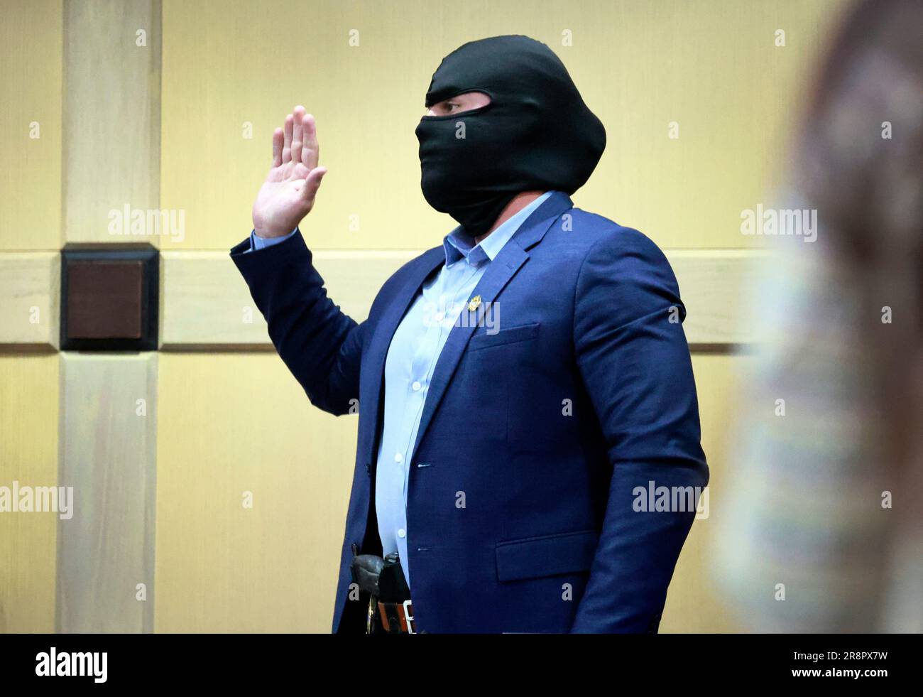 Broward Sheriff's Office Detective Danny Polo, whose face is concealed ...