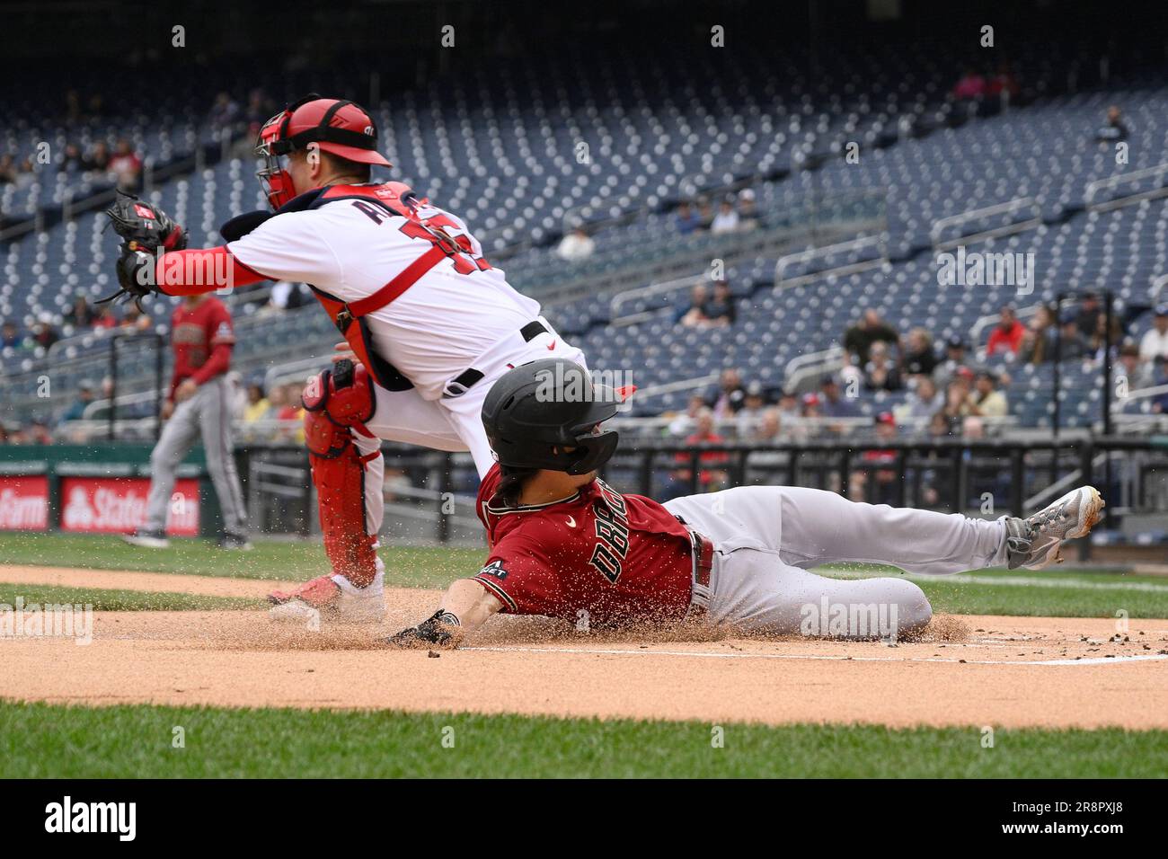Arizona Diamondbacks' Corbin Carroll slides home to score on a single ...