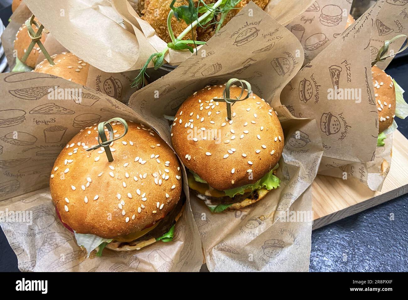 Grilled burger with beef, tomato, cheese, cucumber and lettuce. Fast ...