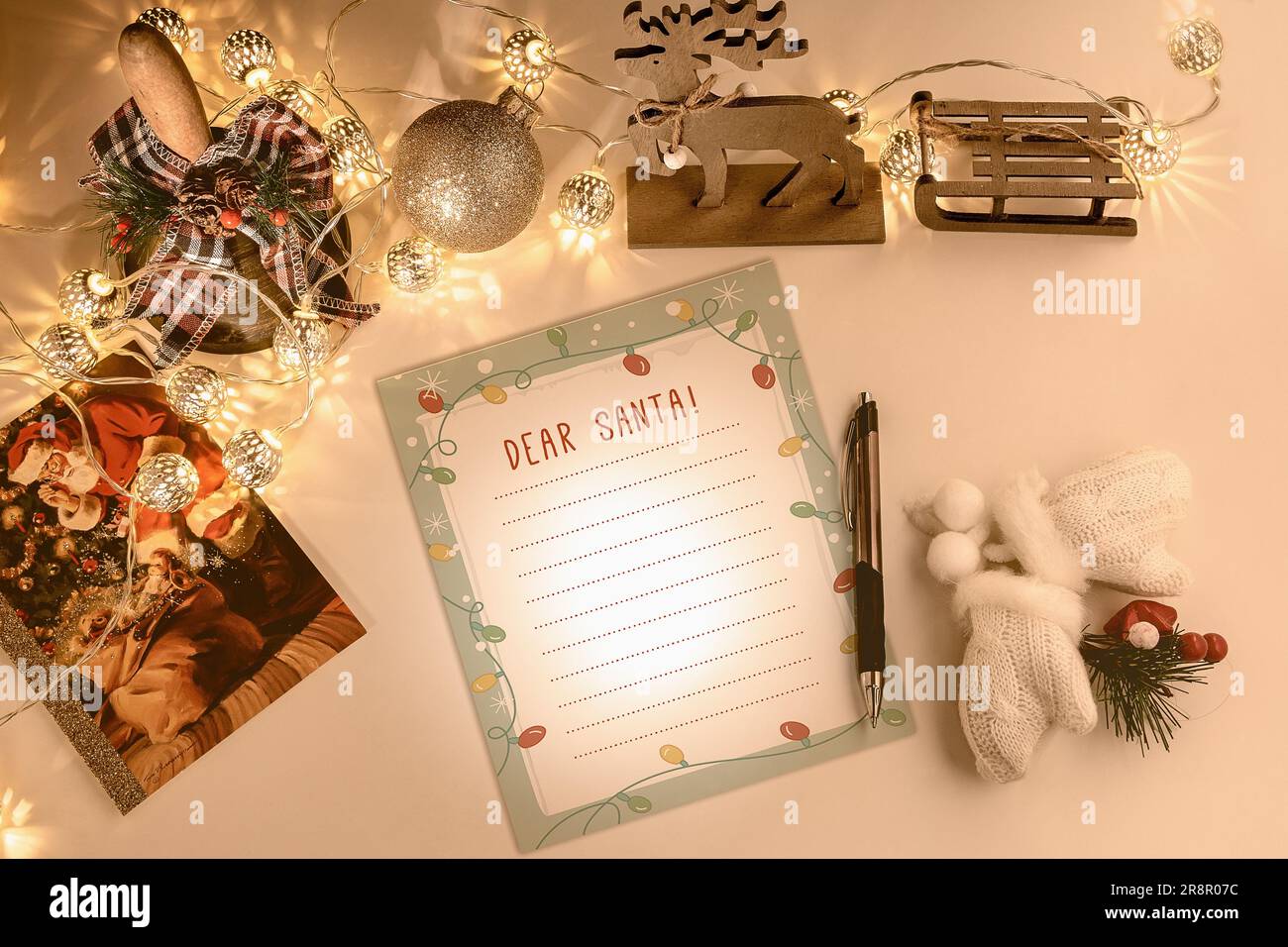 A festive Christmas table setting with paper and a pen ready for ...