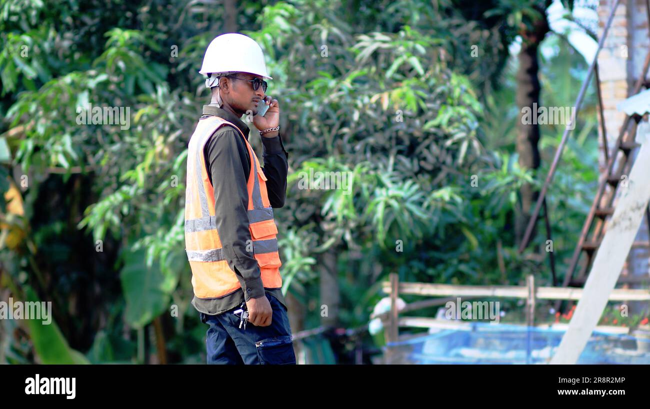 Construction concept: engineer use smartphones in the Construction ...