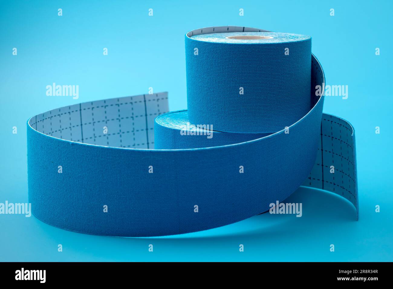 Blue Physio or Kinesiology Tape Rolls on Matching Background Concept ...