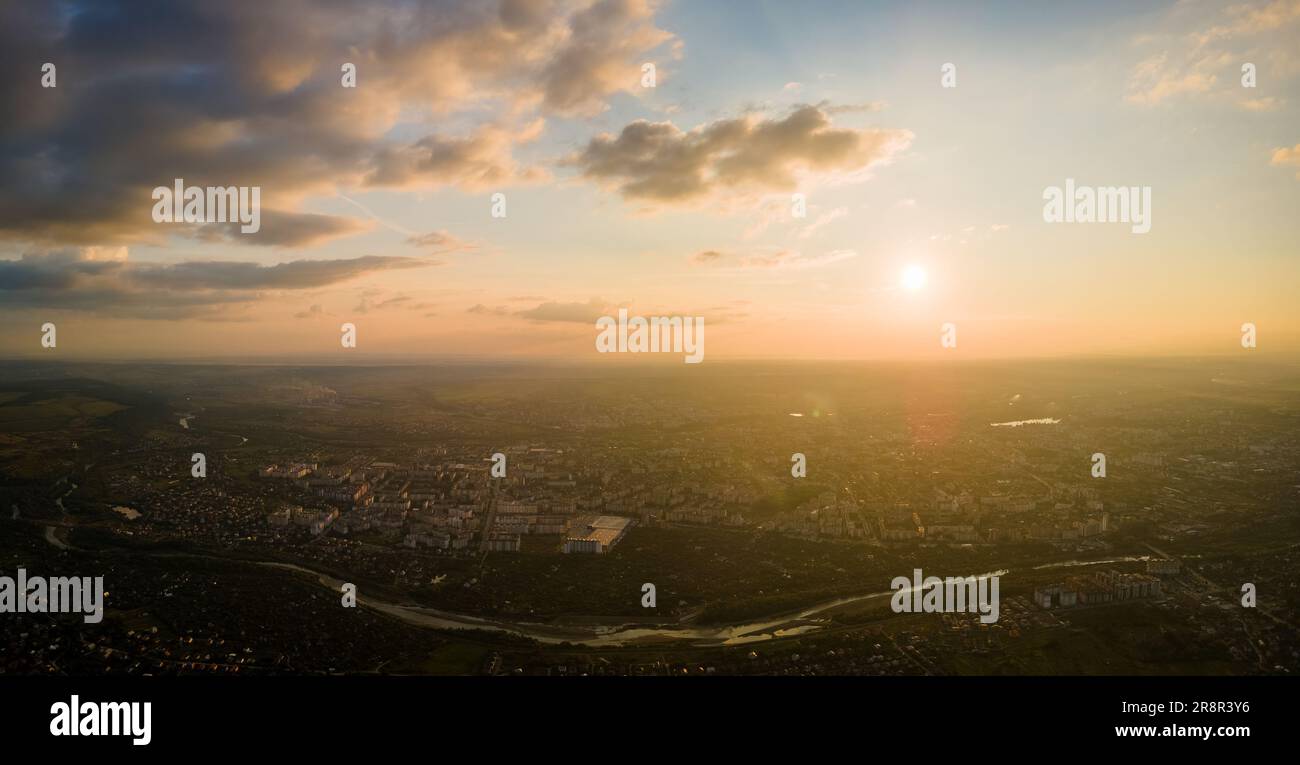 Aerial view from high altitude of distant city covered with puffy ...