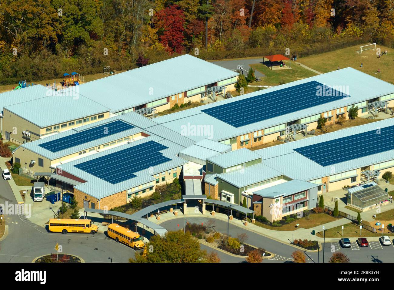 Aerial view of american school building with rooftop covered with ...