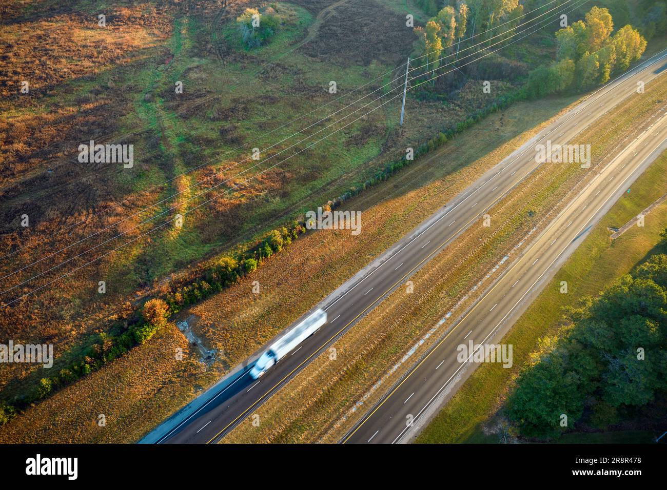 Aerial view of busy american freeway with fast moving cars and trucks ...