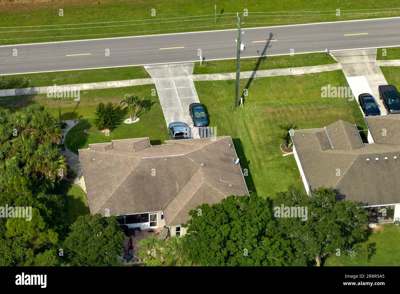 Aerial view of typical contemporary american private house with roof ...