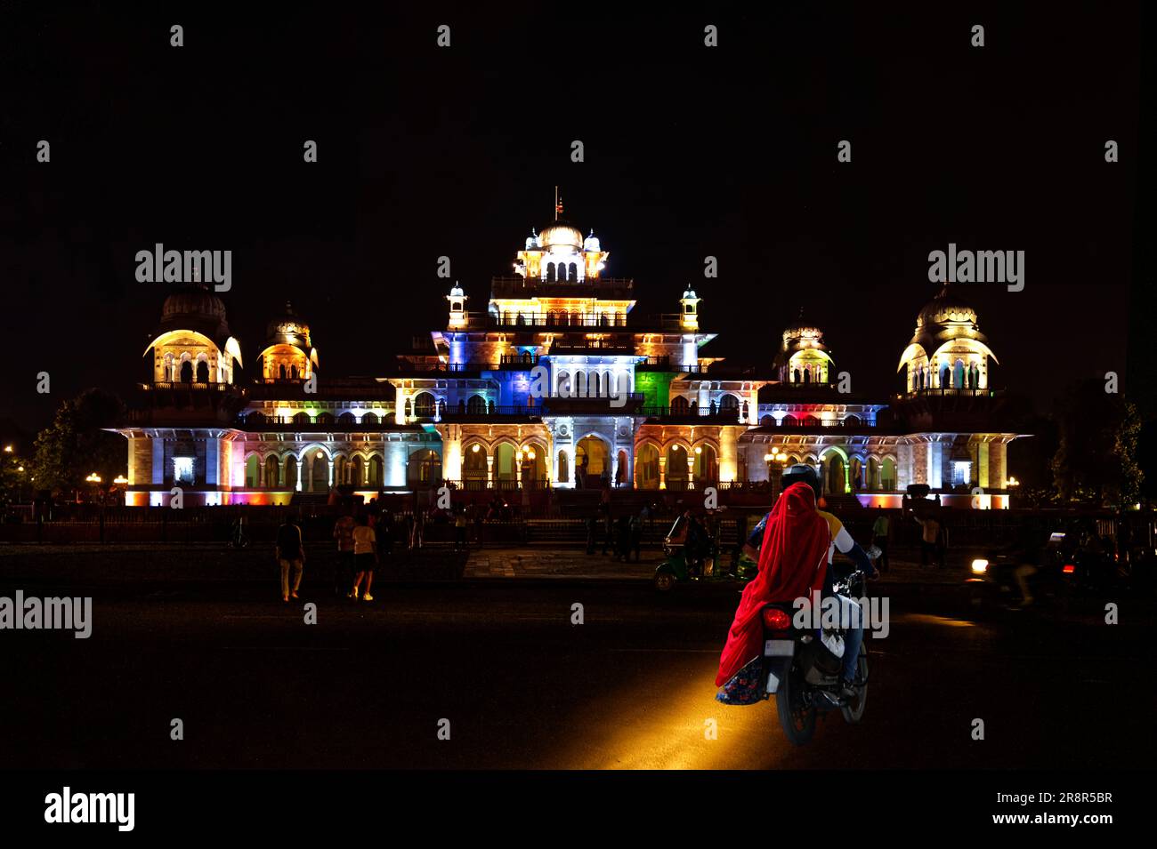 Colorful lights on the facade of the opera house in Jaipur at the night ...