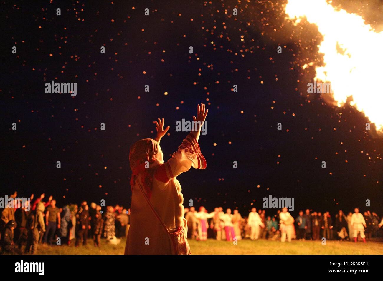 People wearing traditional Russian village-style clothes celebrate the ...