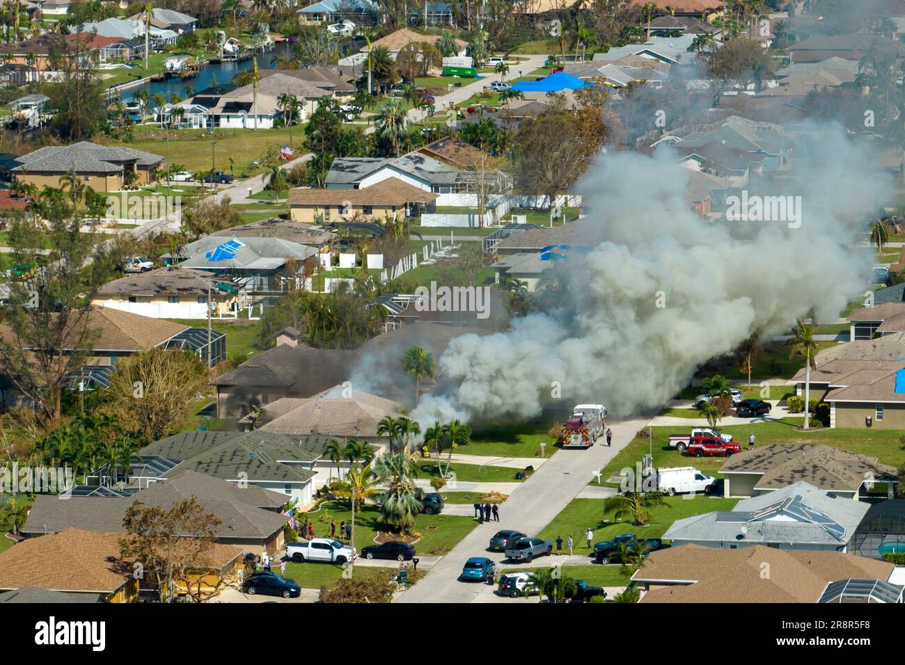 Burning residential house on fire with smoke and flames after short ...