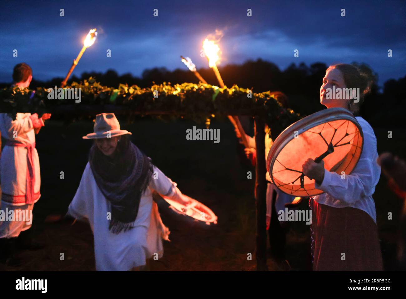 People wearing traditional Russian village-style clothes celebrate the ...