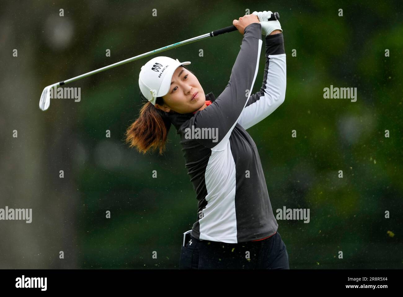 Xiyu Lin, of China, tees off on the fourth hole during the first round ...