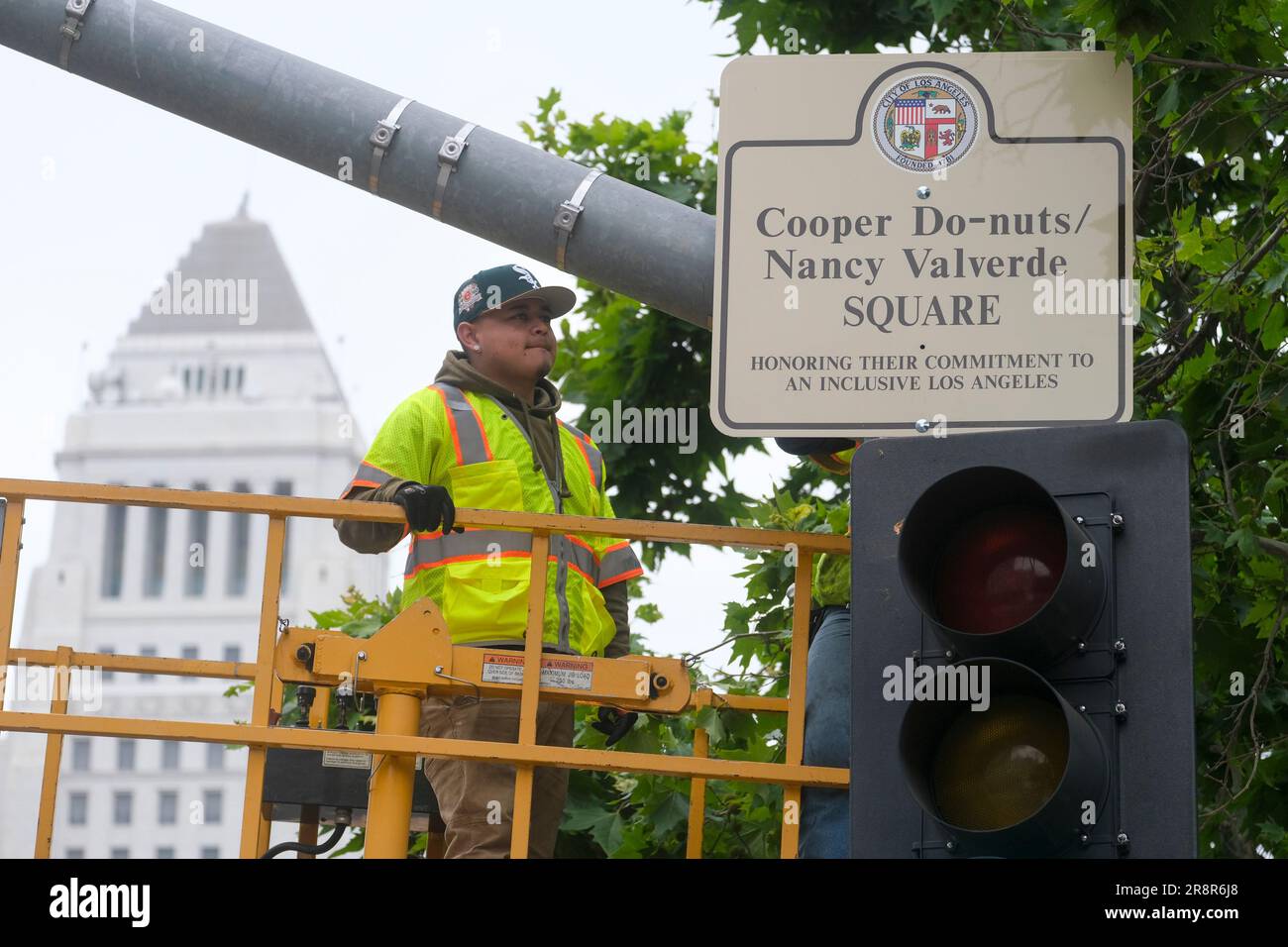 Los Angeles, California, USA. 22nd June, 2023. Workers install a sign ...
