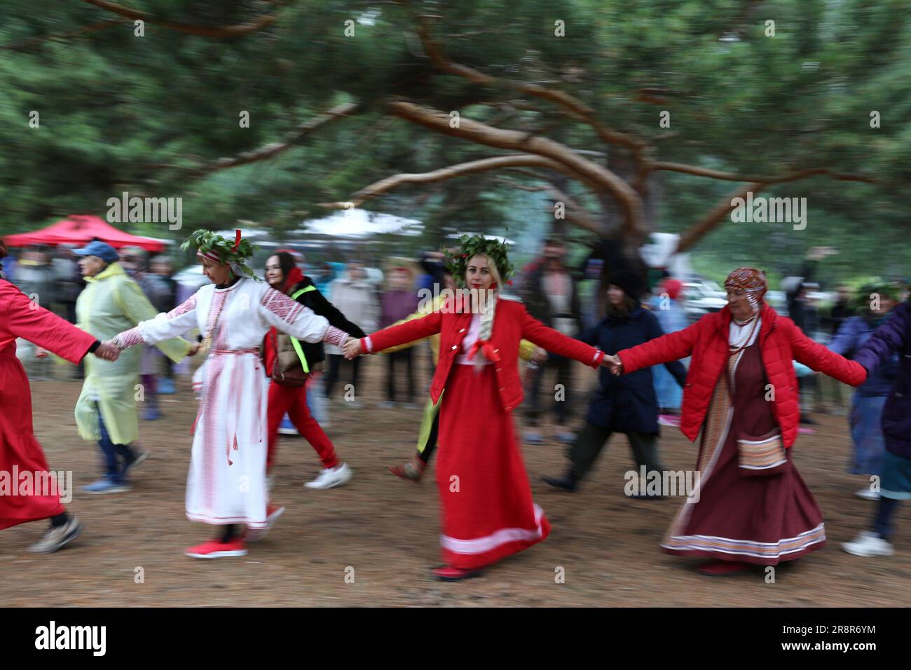 People wearing traditional Russian village-style clothes celebrate the ...