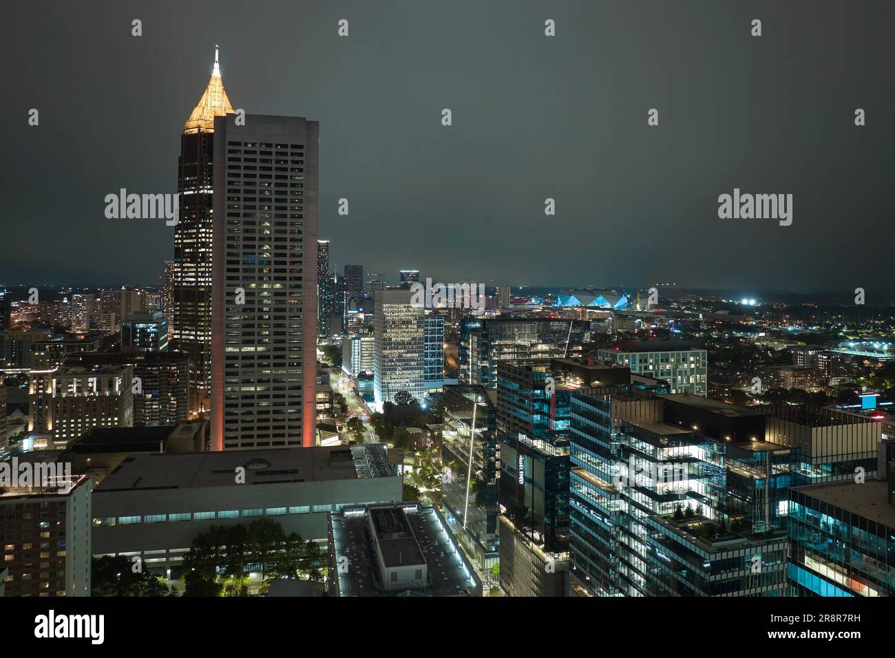 View from above of brightly illuminated high skyscraper buildings in ...