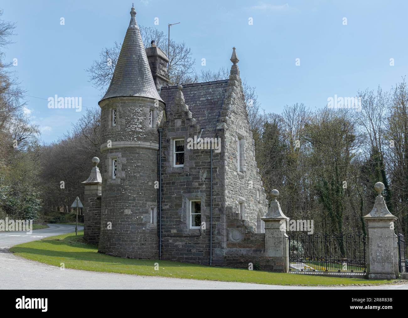 Scottish gatehouse with turret made of grey stone Stock Photo - Alamy