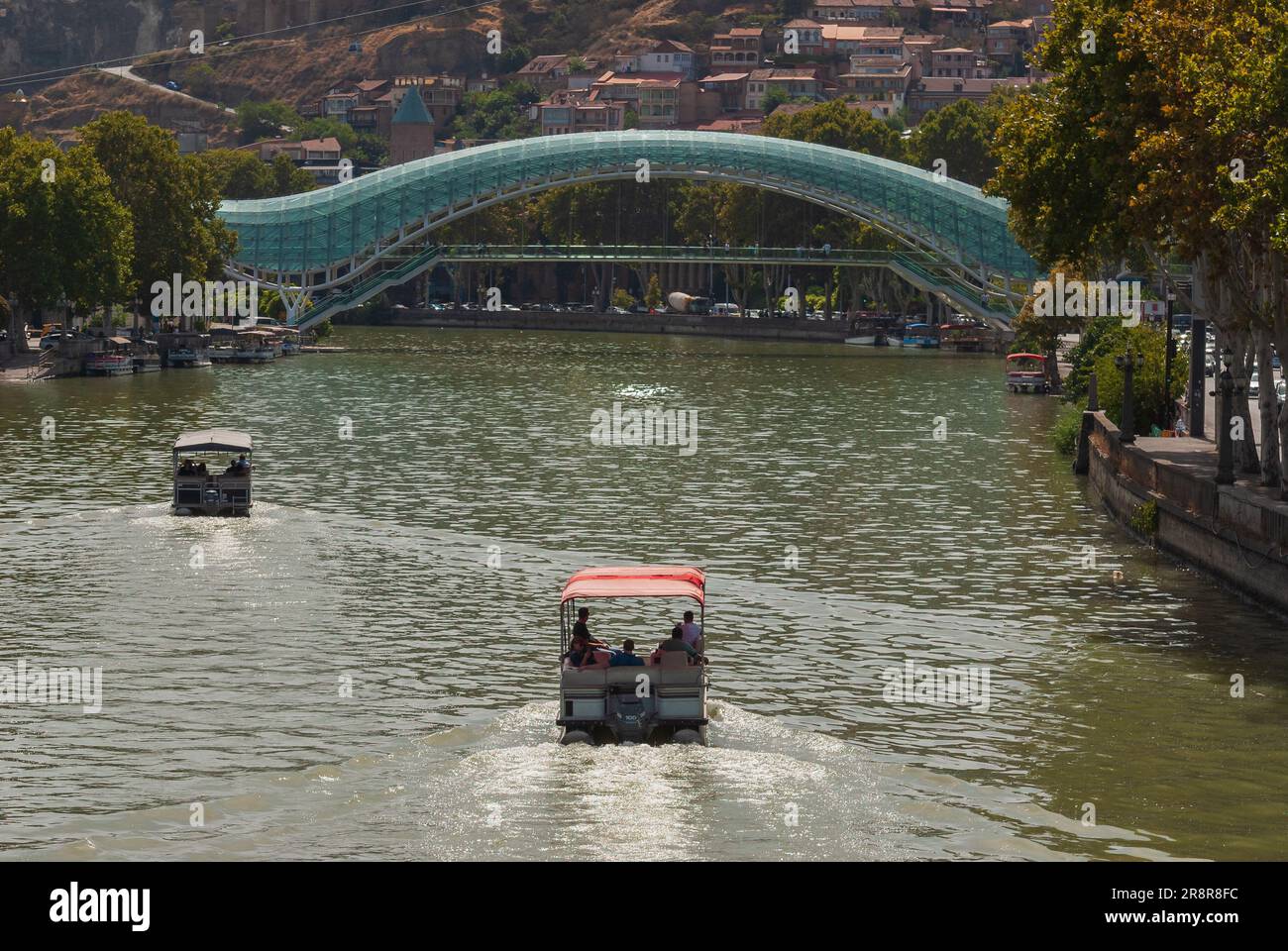 Georgia, Tbilisi - September 17, 2022: Tourists ride on a pleasure boat ...