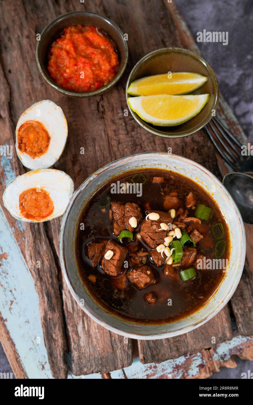 Indonesian beef black soup : Rawon Stock Photo - Alamy