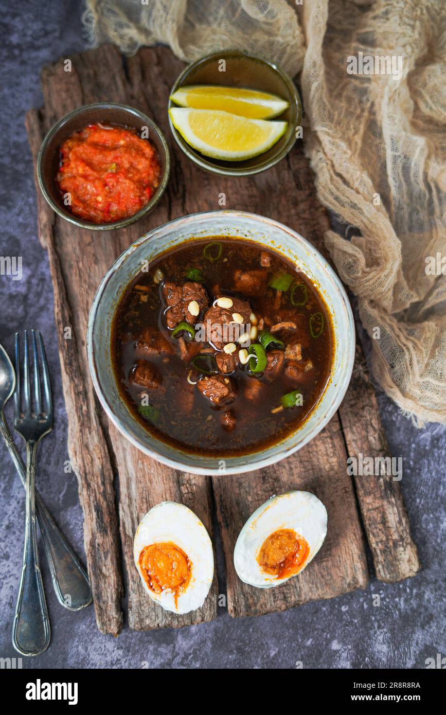 Indonesian beef black soup : Rawon Stock Photo - Alamy