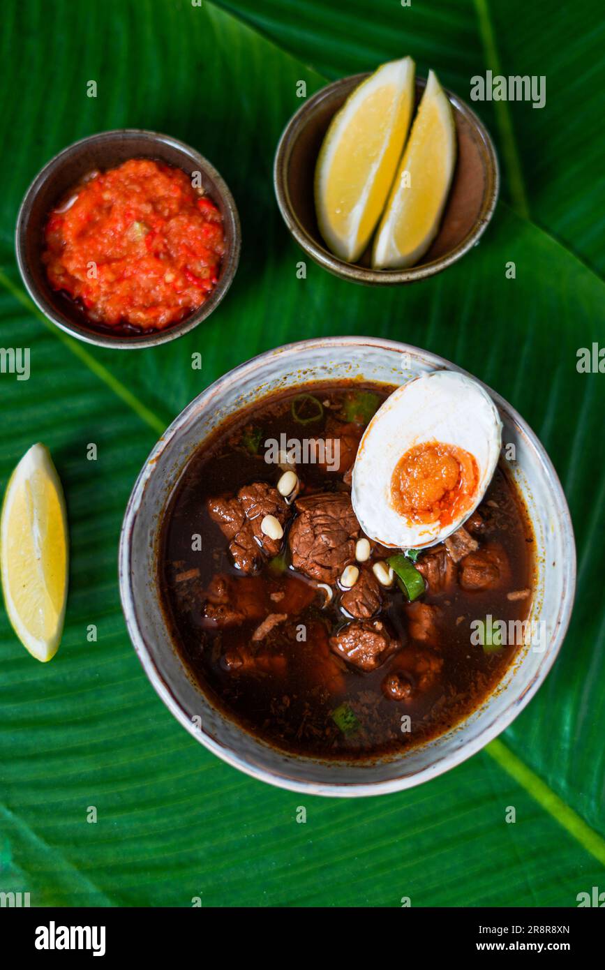 Indonesian beef black soup : Rawon Stock Photo - Alamy