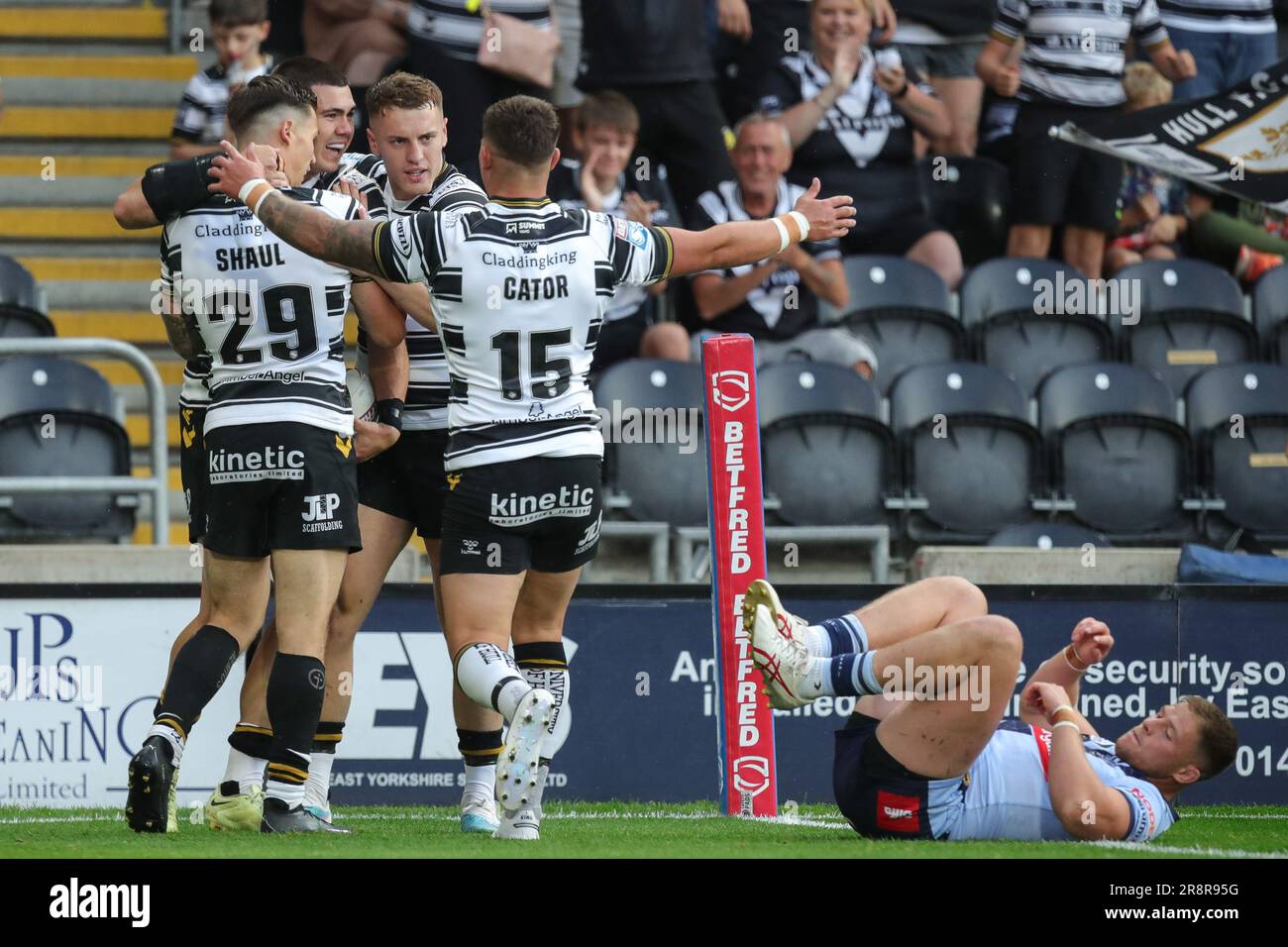 Jake Clifford #7 of Hull FC celebrates his try with his team mates and ...