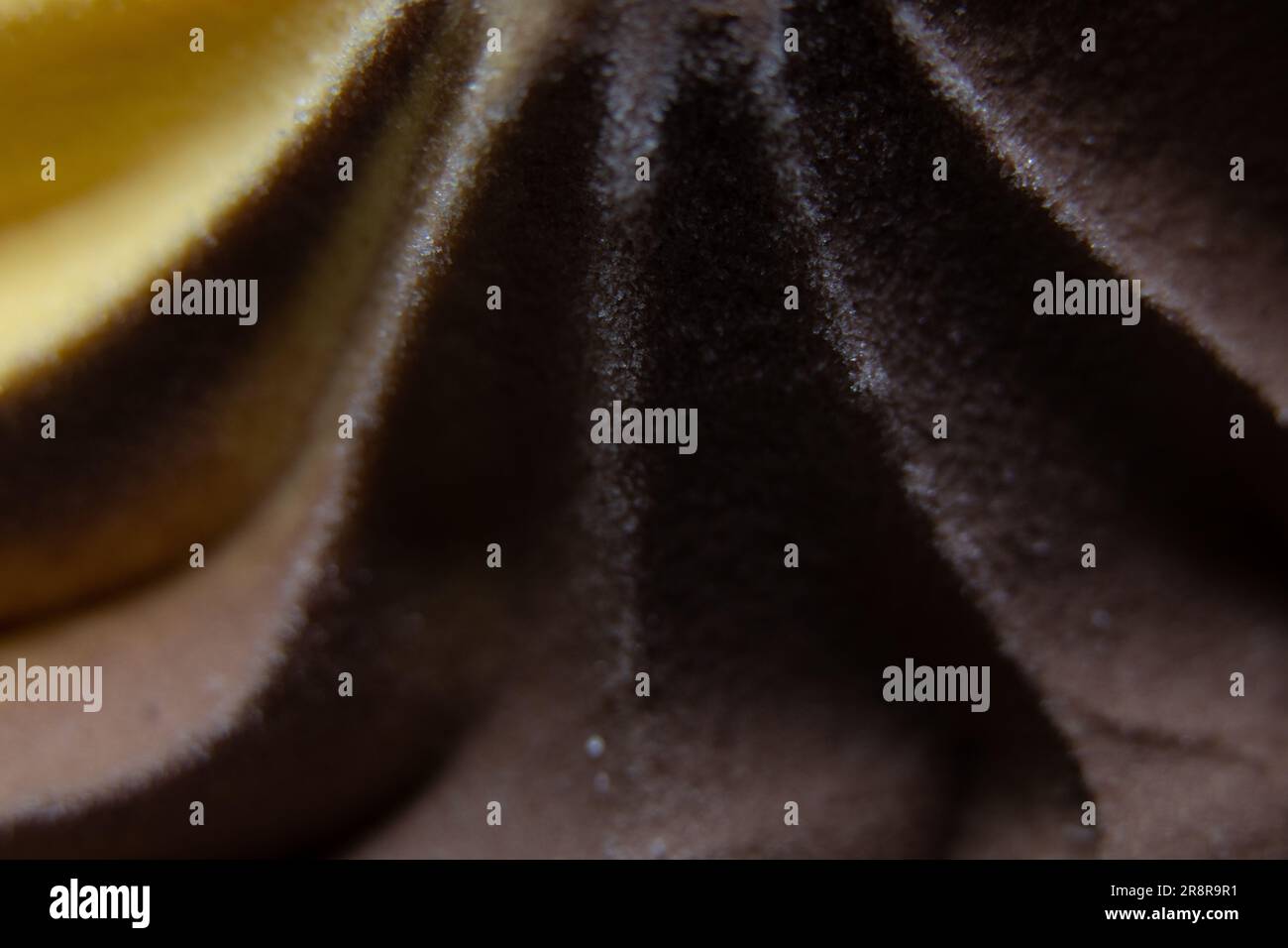 chocolate orange ice cream wave as background macro Stock Photo - Alamy