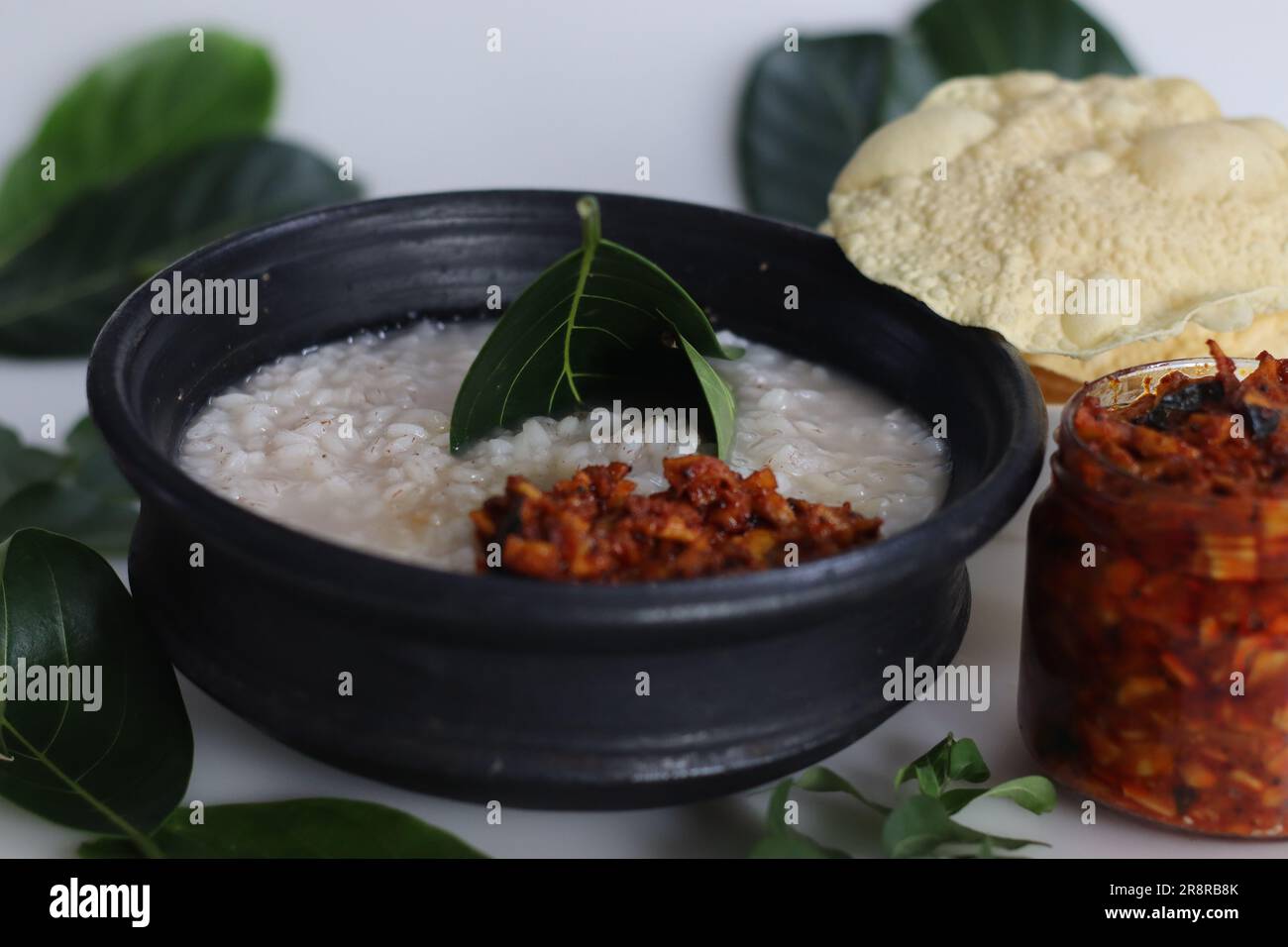 Kanji and Kadumanga. Rice gruel prepared with Matta rice. Served in ...