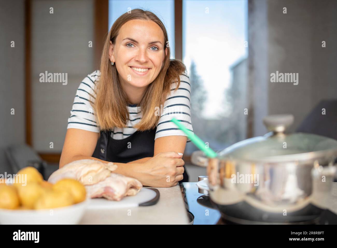 Young woman is cooking in the kitchen. Healthy eating. Healthy ...