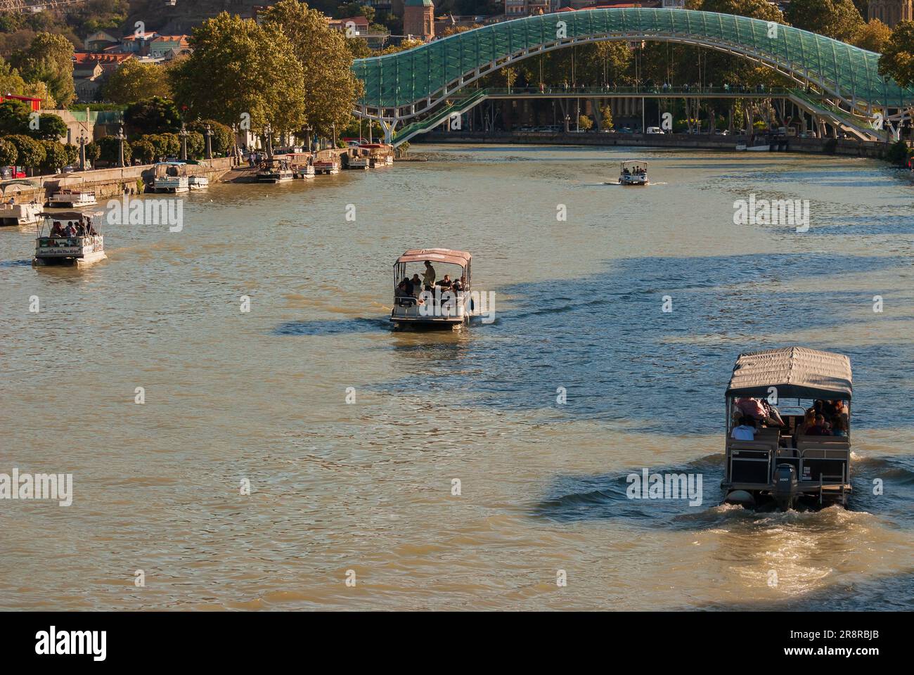 Georgia, Tbilisi - September 25, 2022: Tourists ride on a pleasure boat ...