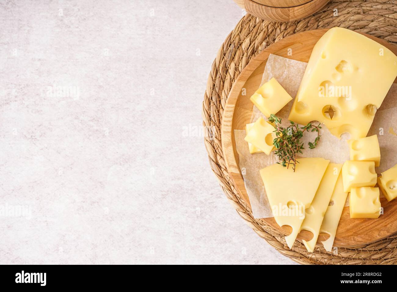 Plate with pieces of Swiss cheese on white background Stock Photo - Alamy