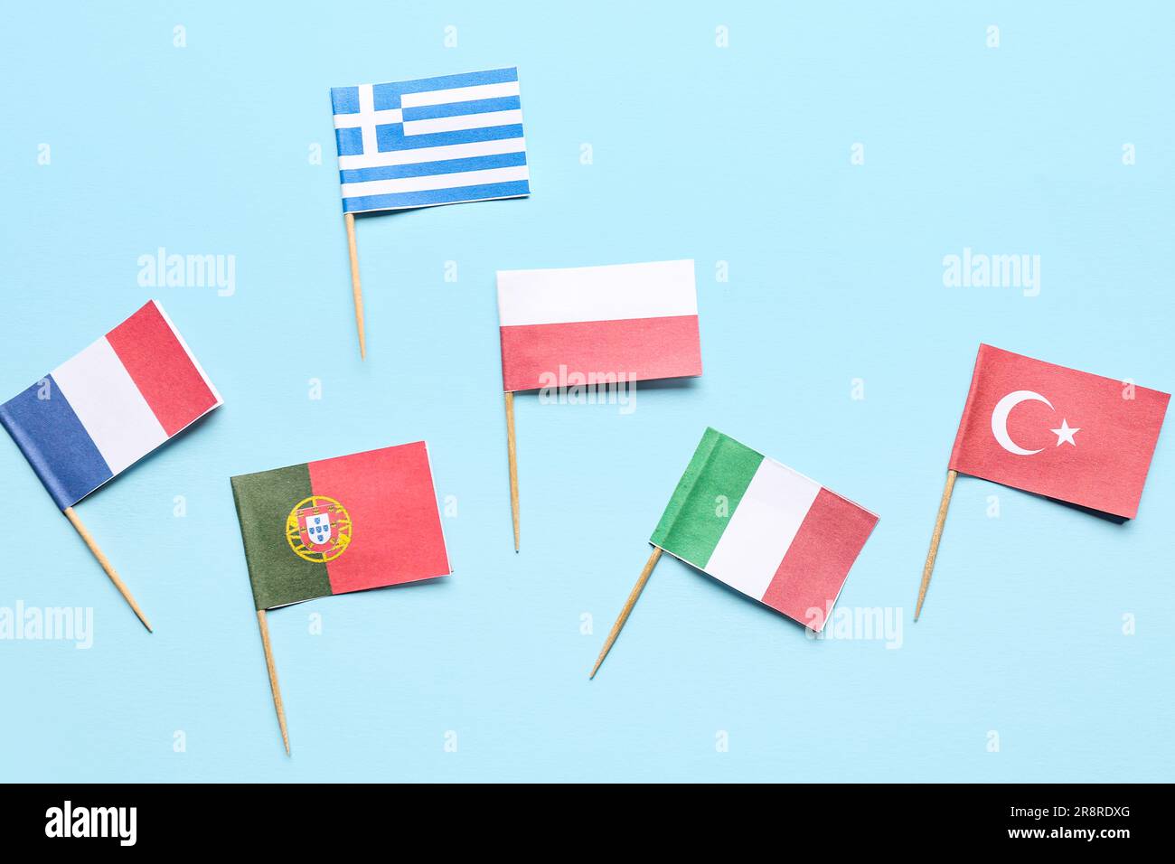 Paper flags of different countries on blue background Stock Photo - Alamy
