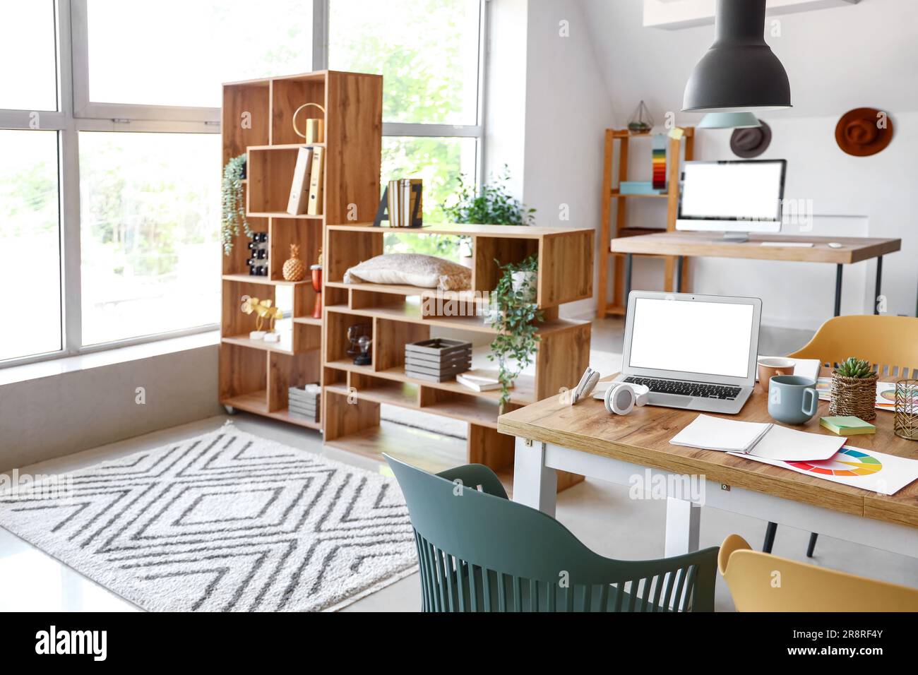 Graphic designer's workplace with laptop in interior of office Stock ...