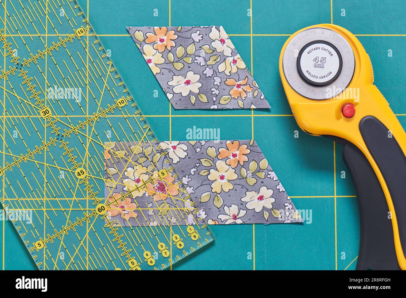 The process of cutting pieces of fabric in the shape of diamonds to ...