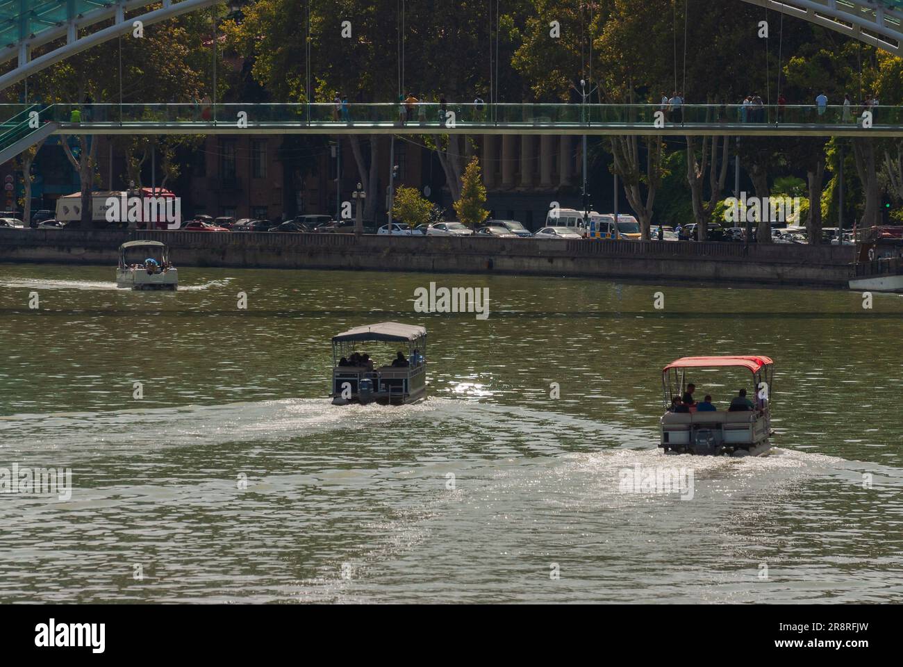 Georgia, Tbilisi - September 17, 2022: Tourists ride on a pleasure boat ...