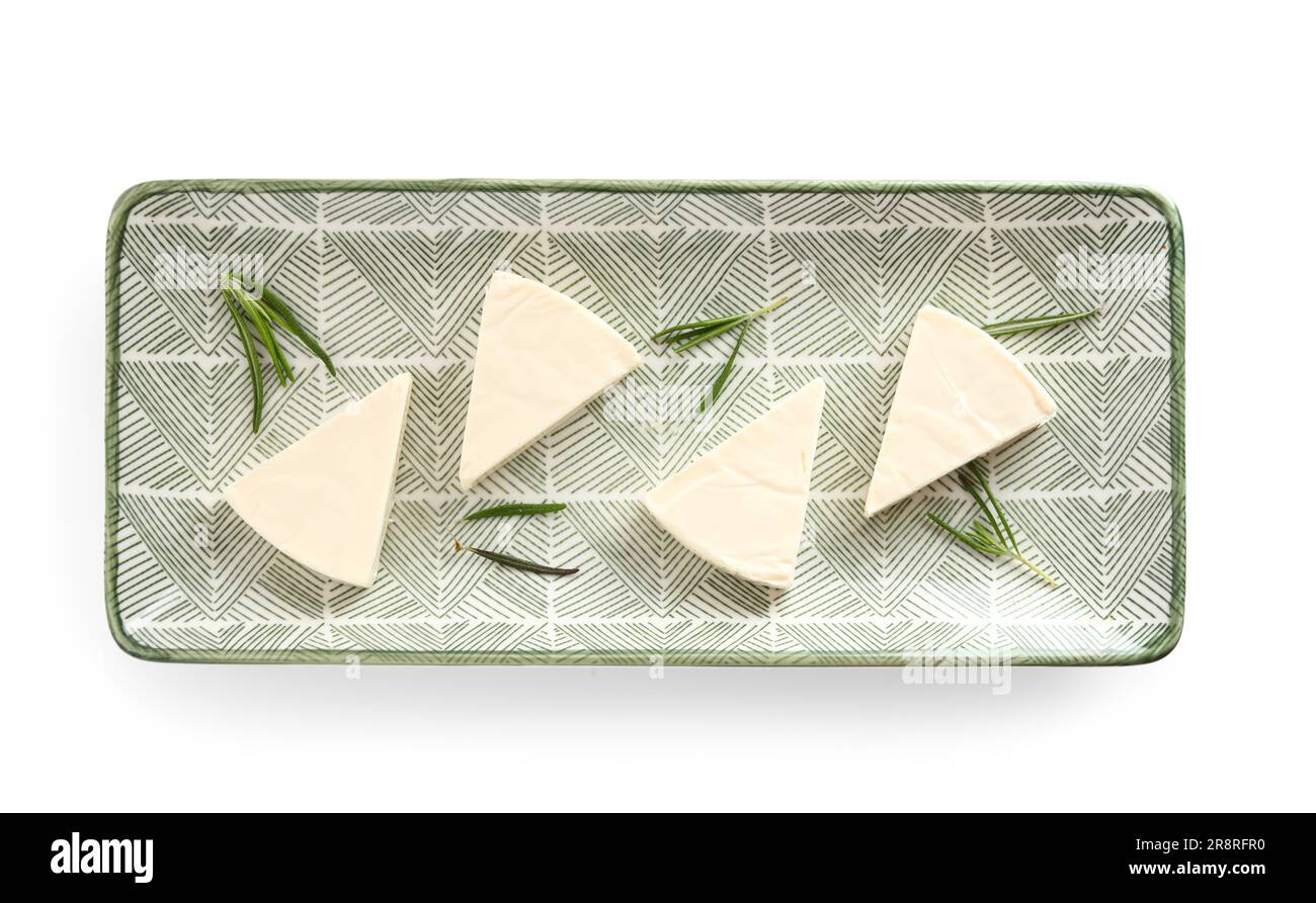 Plate with triangles of tasty processed cheese on white background ...