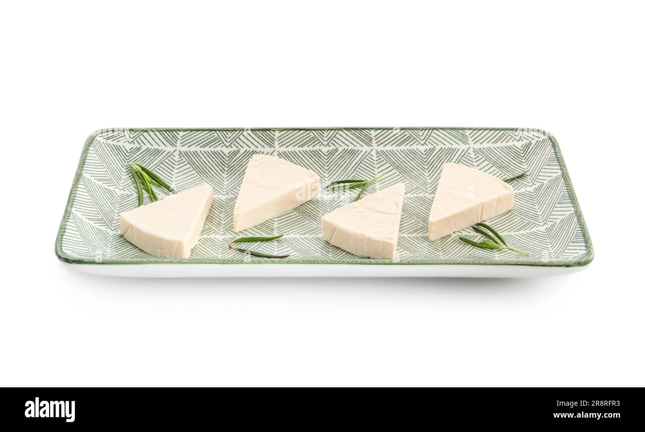 Plate with triangles of tasty processed cheese on white background ...