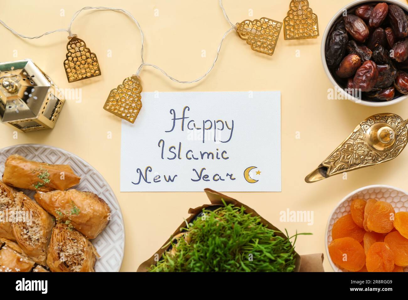 Card with text HAPPY ISLAMIC NEW YEAR, Aladdin lamp and sweets on color ...