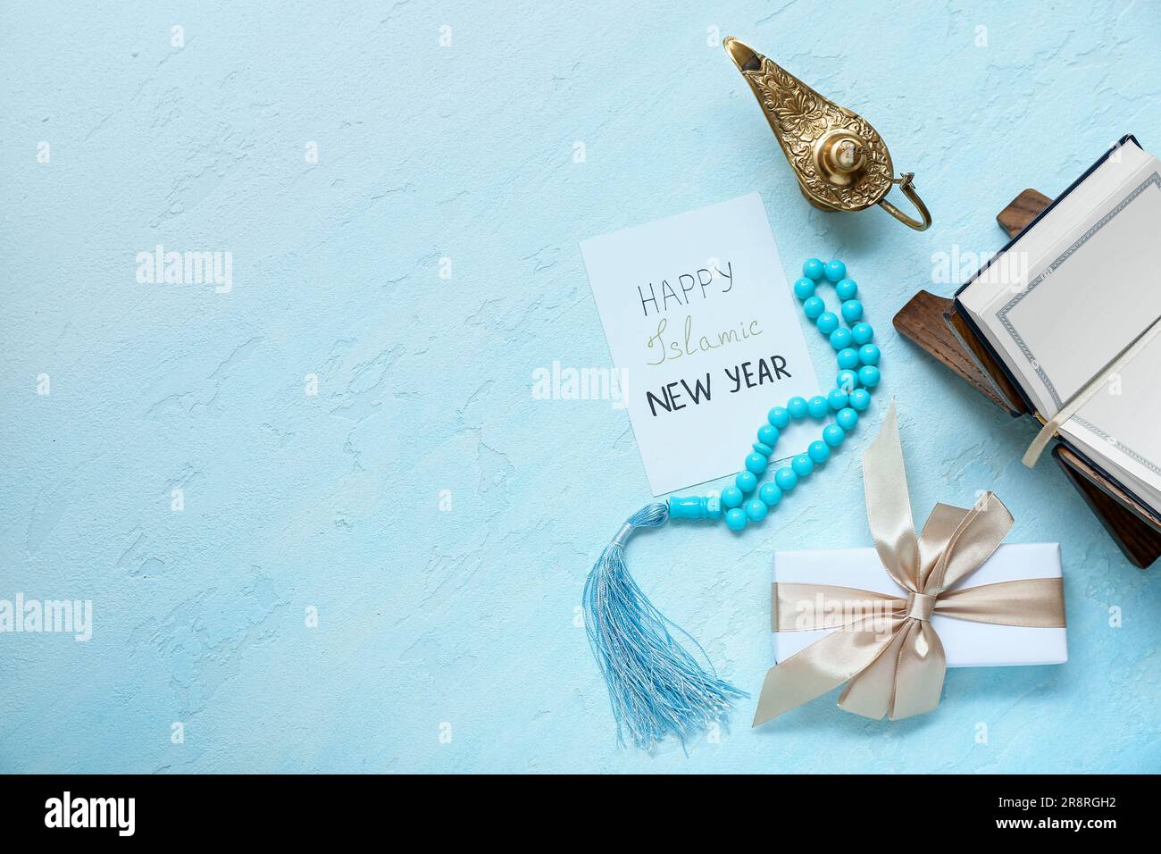 Card with text HAPPY ISLAMIC NEW YEAR, tasbih, Aladdin lamp and Koran ...