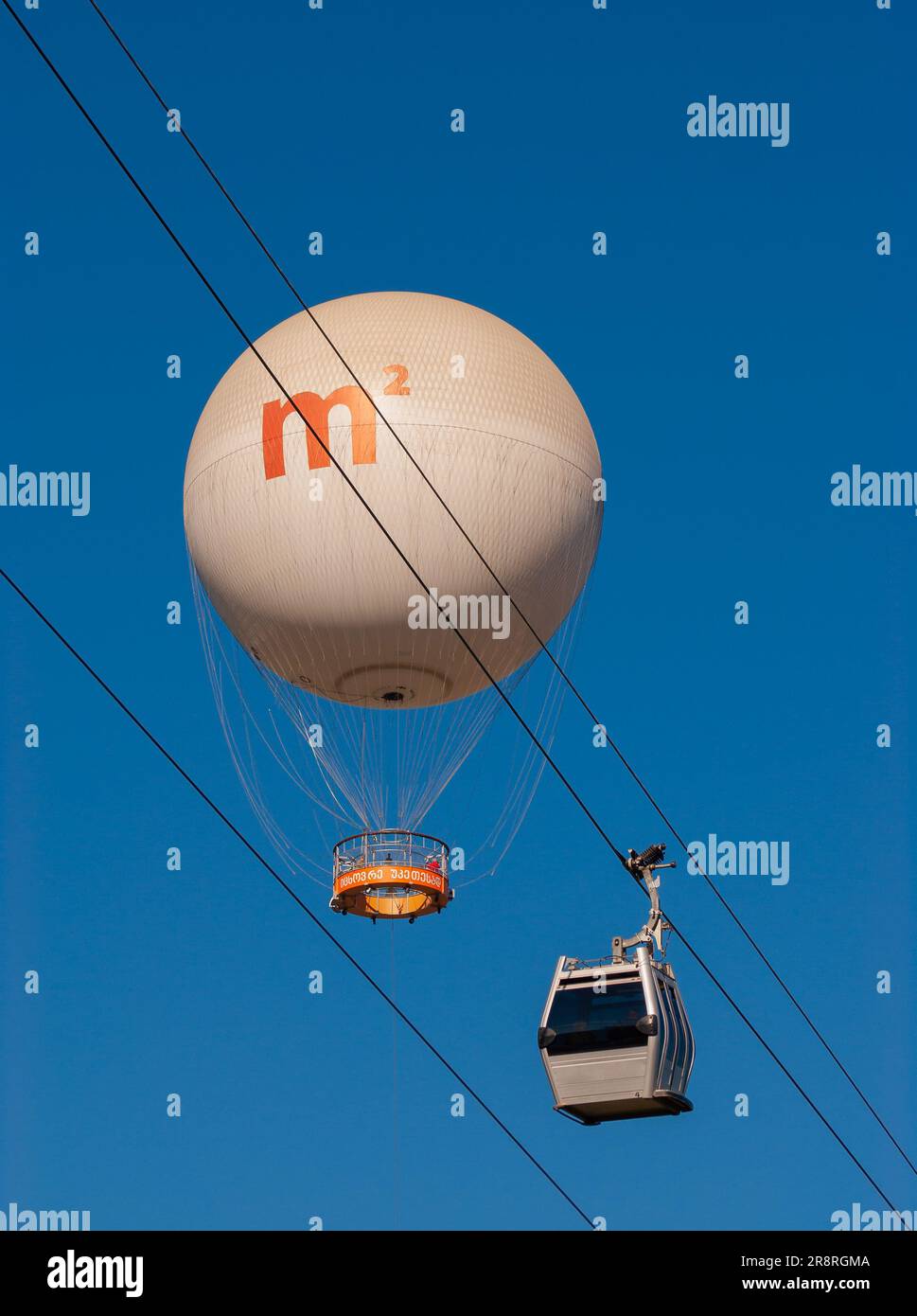 Georgia, Tbilisi - October 30, 2022: Air excursion balloon and cable ...